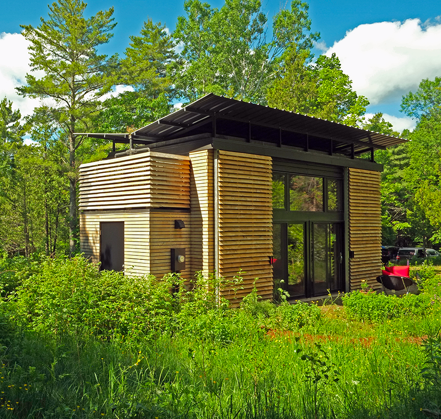 Transformer CNC cabin by a lake as a father-son work dialogue ...